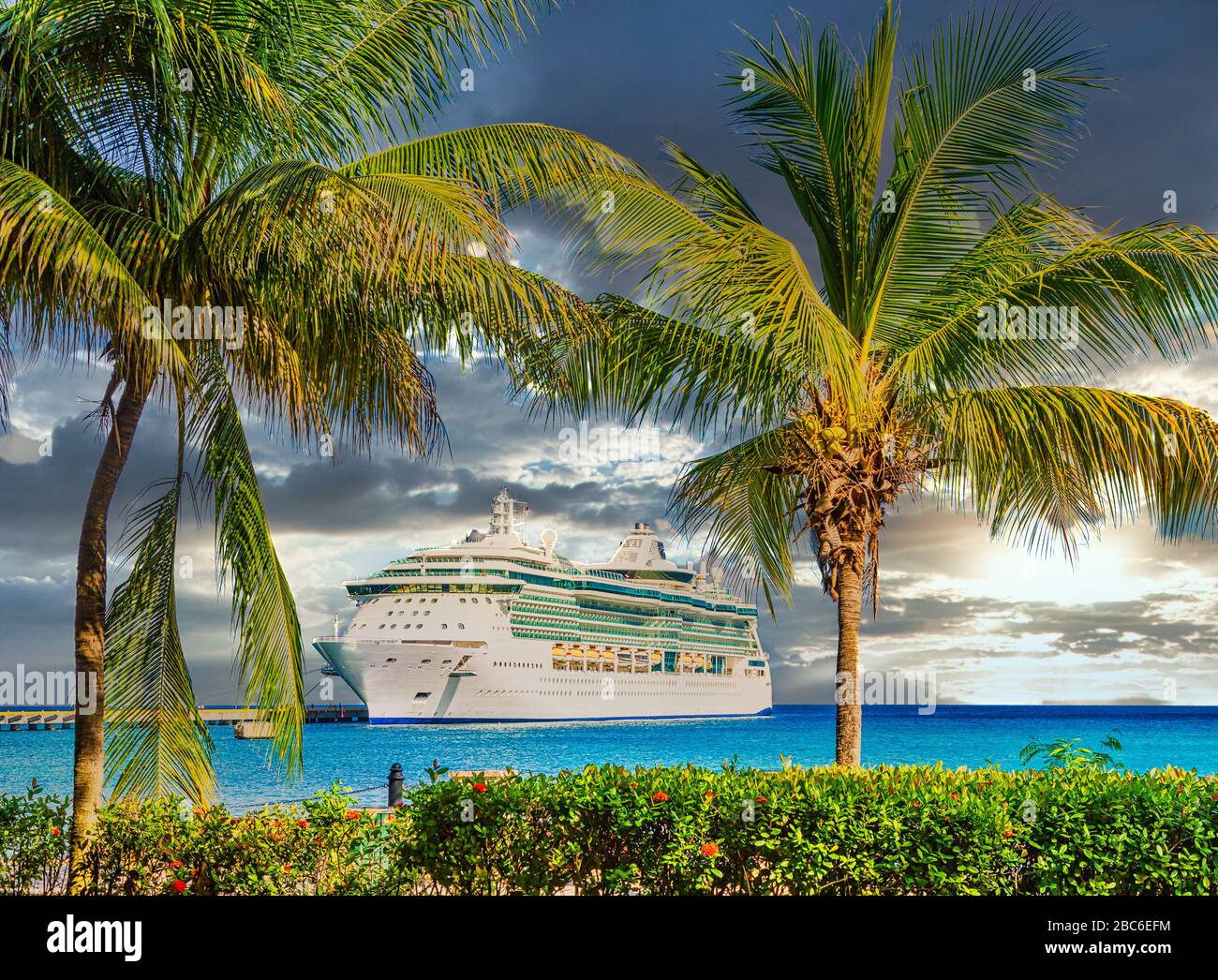 Cruise Ship Between Palm Trees at Sunset Stock Photo - Alamy