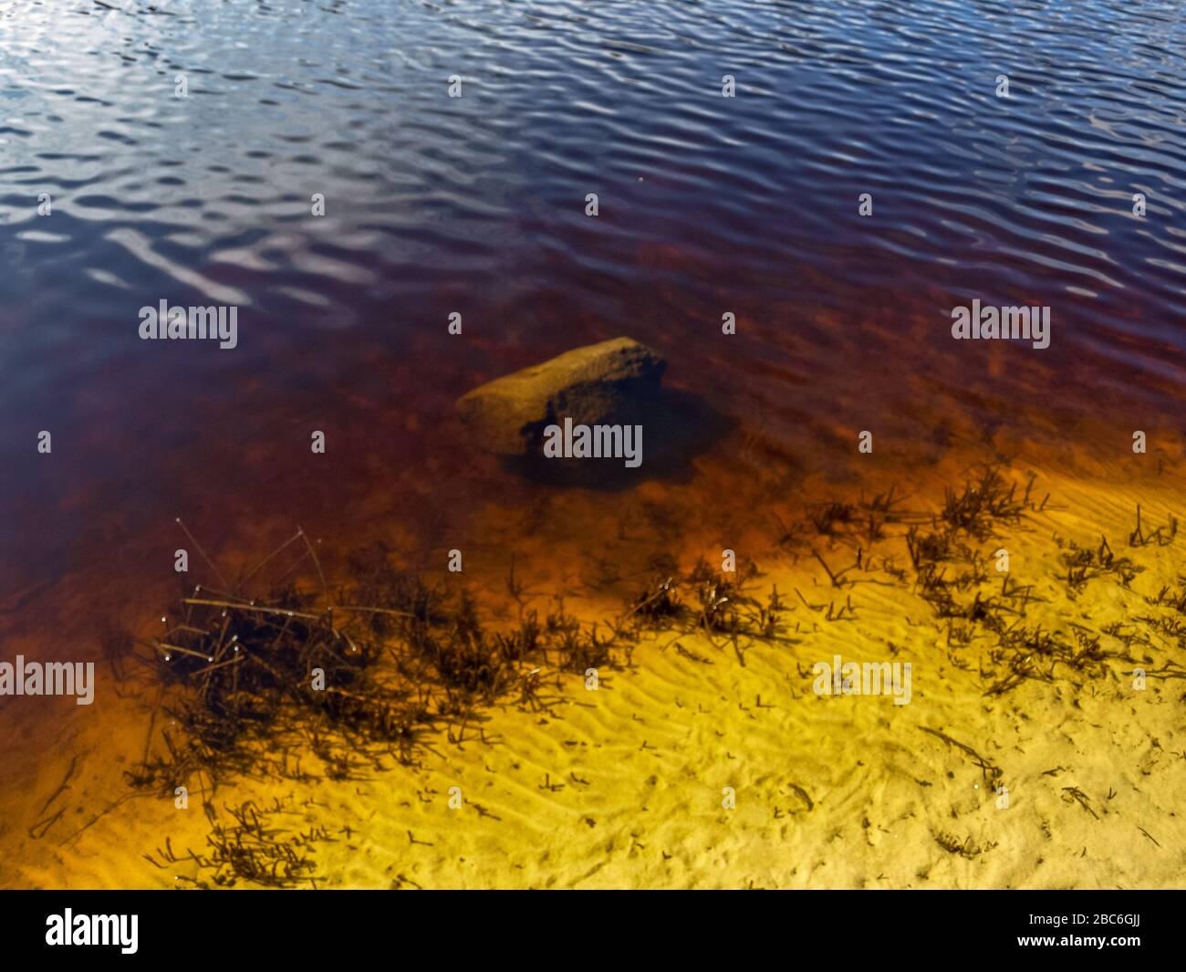 colorful abstract picture where spring water connects with lake water ...