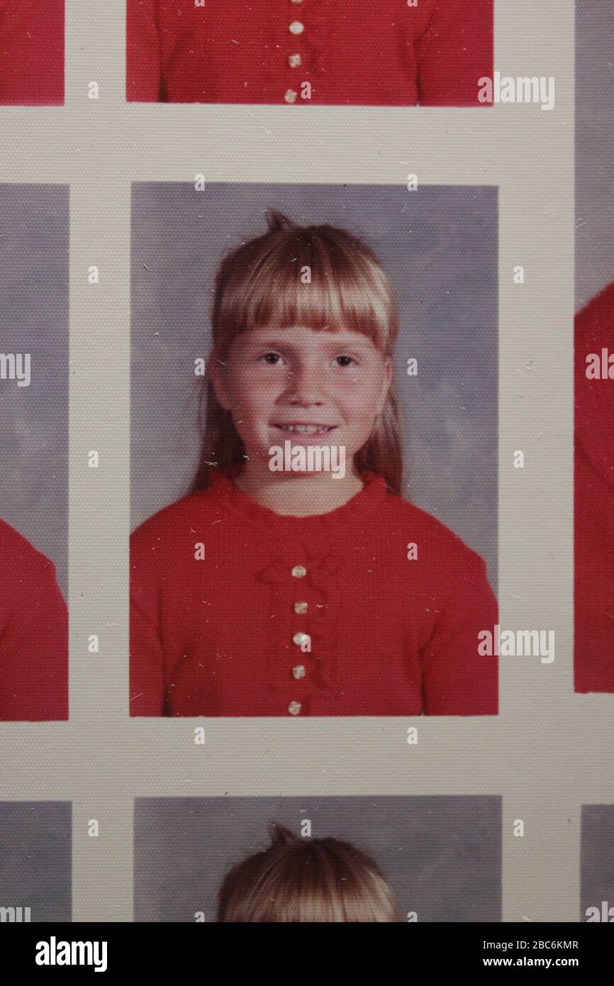 Formal grade school portrait of a beautiful young caucasian girl with ...