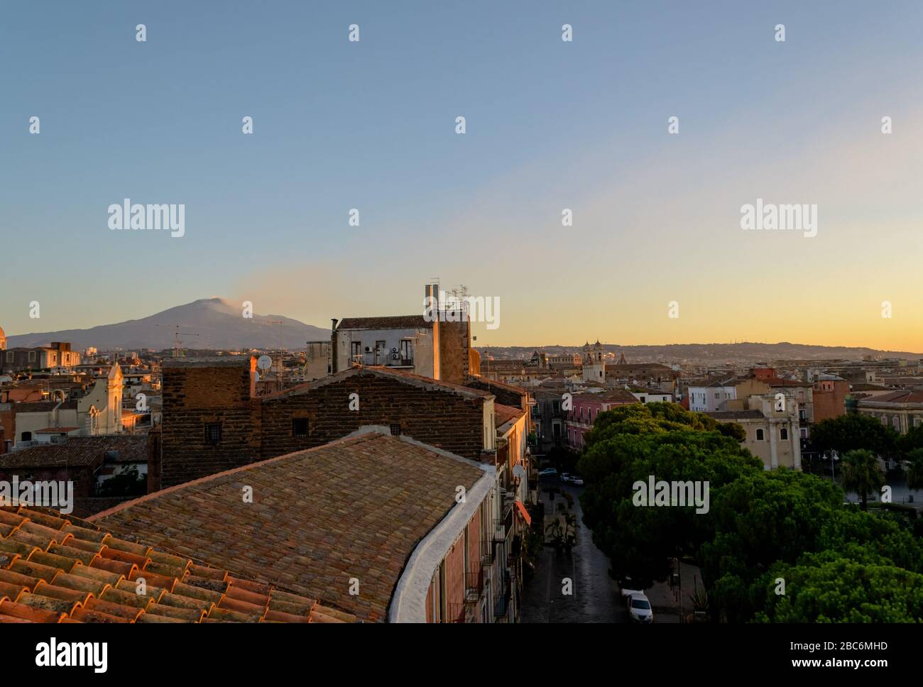 Catania, Sicily in Italy. Aerial view of the city roofs at sunset with ...