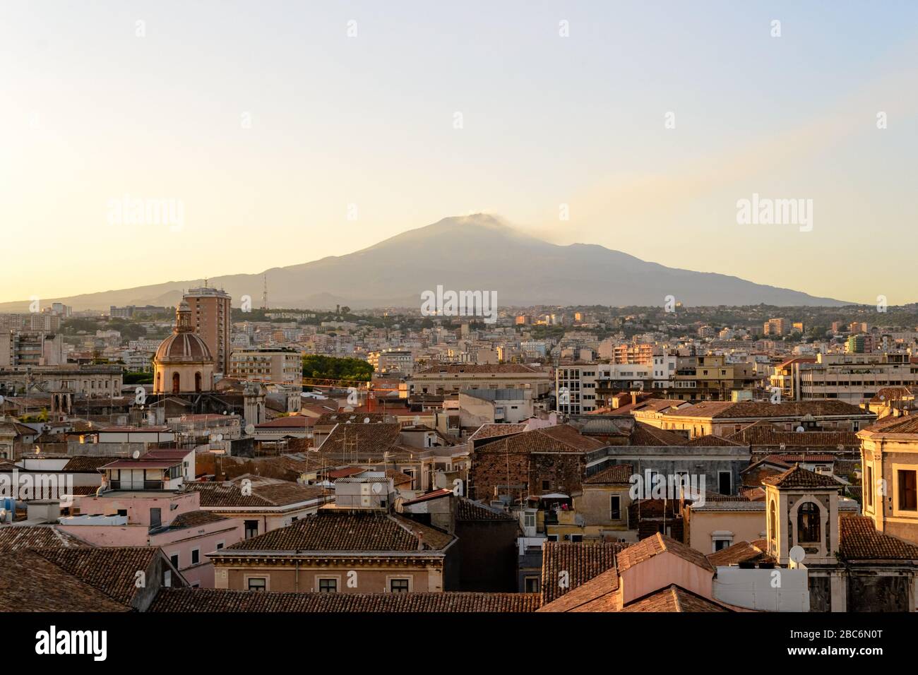 Catania, Sicily in Italy. Aerial view of the city roofs at sunset with ...