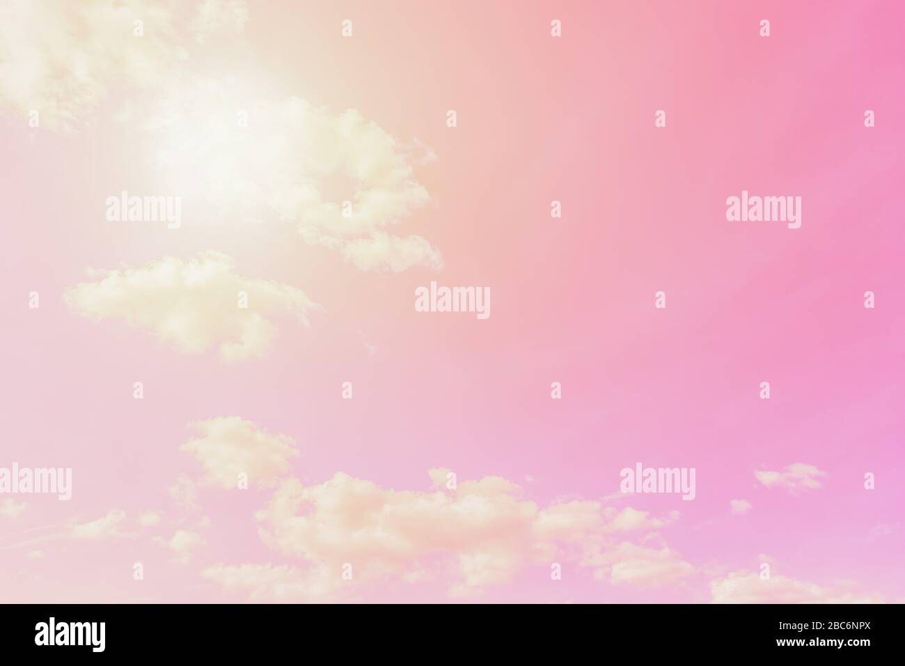 Sunny pink sky background. Beautiful warm sky with clouds. Toned photo ...