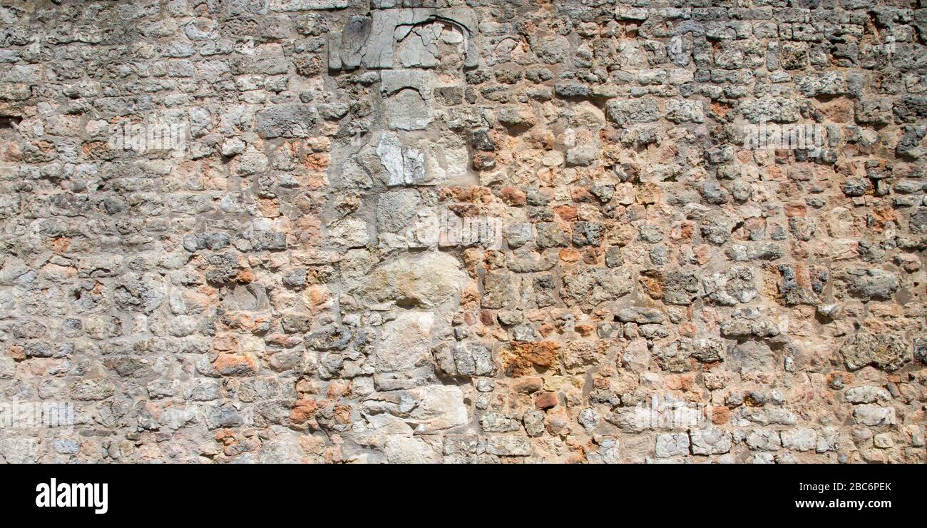 Stone wall background of stones old texture ancient Stock Photo - Alamy