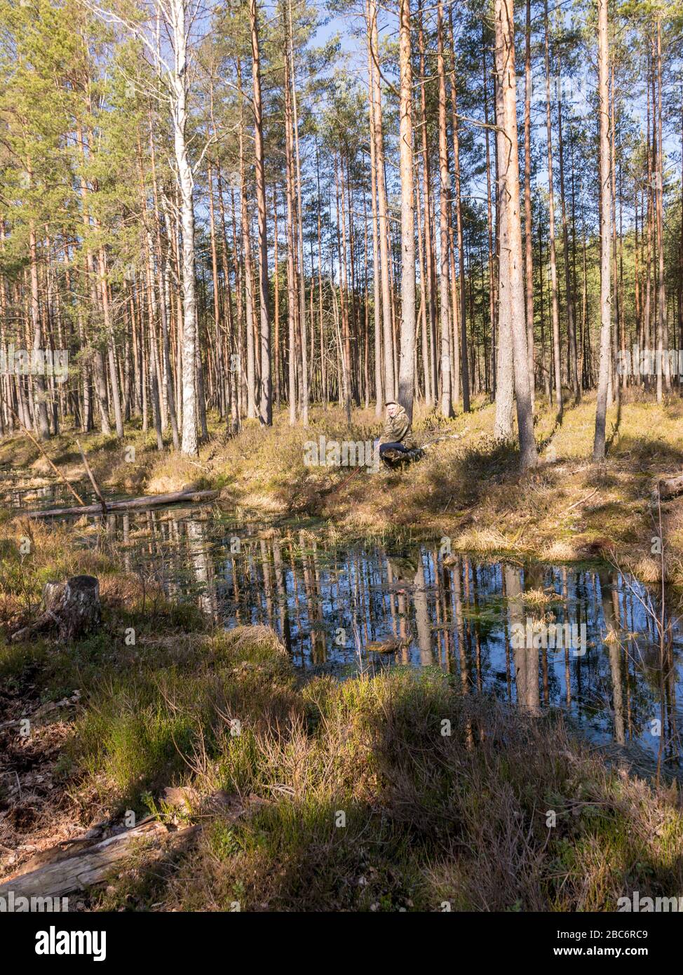 picture of a human figure in a swamp, a big and wet ditch Stock Photo ...