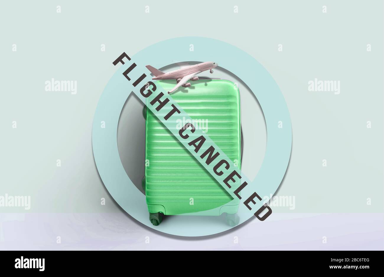 Green suitcase and plane standing with "no entry sign" and message ...