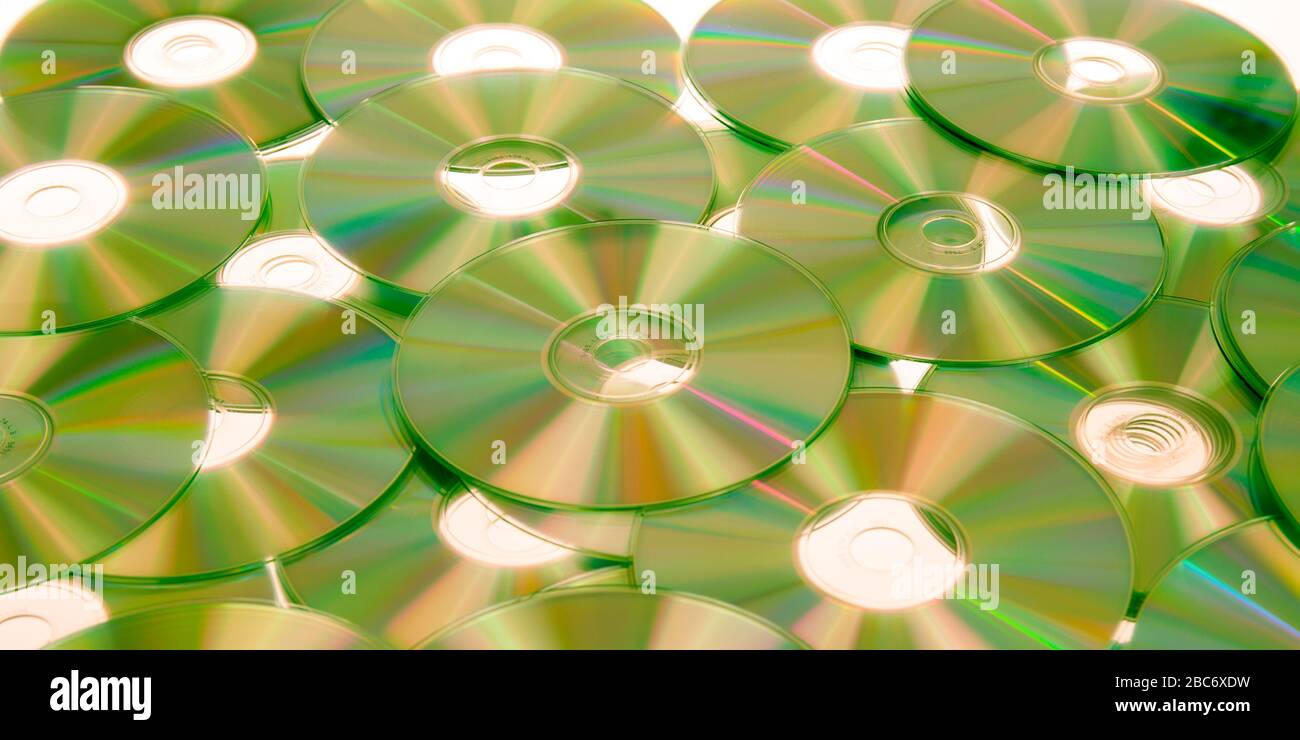 Rainbow yellow cd collection dvd bluray on background top view ...