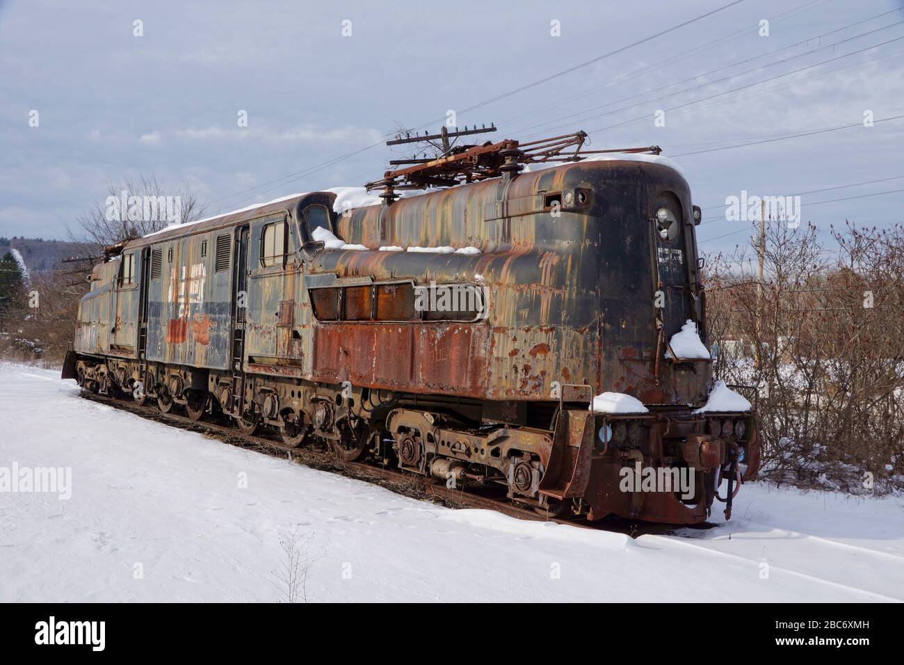 Rusty old train locomotive in the snow Stock Photo - Alamy