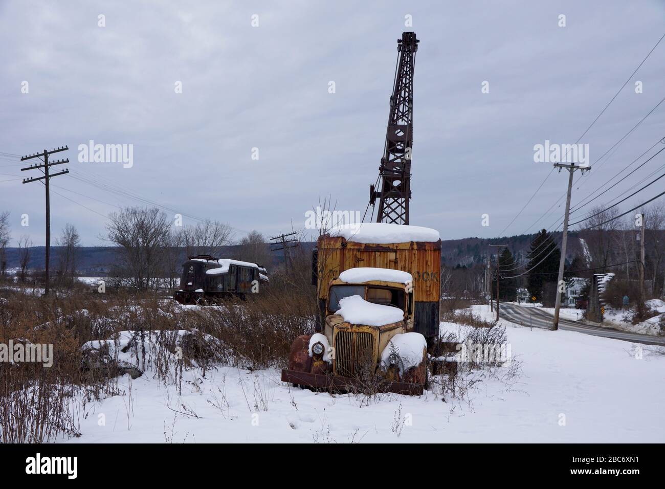 Rusty old tow truck and train locomotive in the snow Stock Photo - Alamy