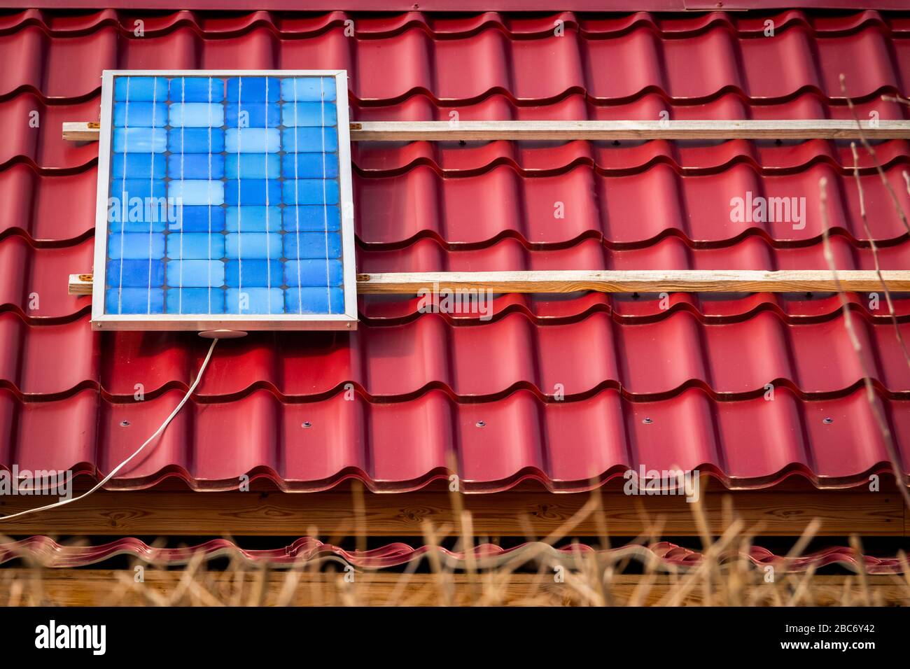 Solar battery on the roof of a rural house. Start of assembly Stock ...
