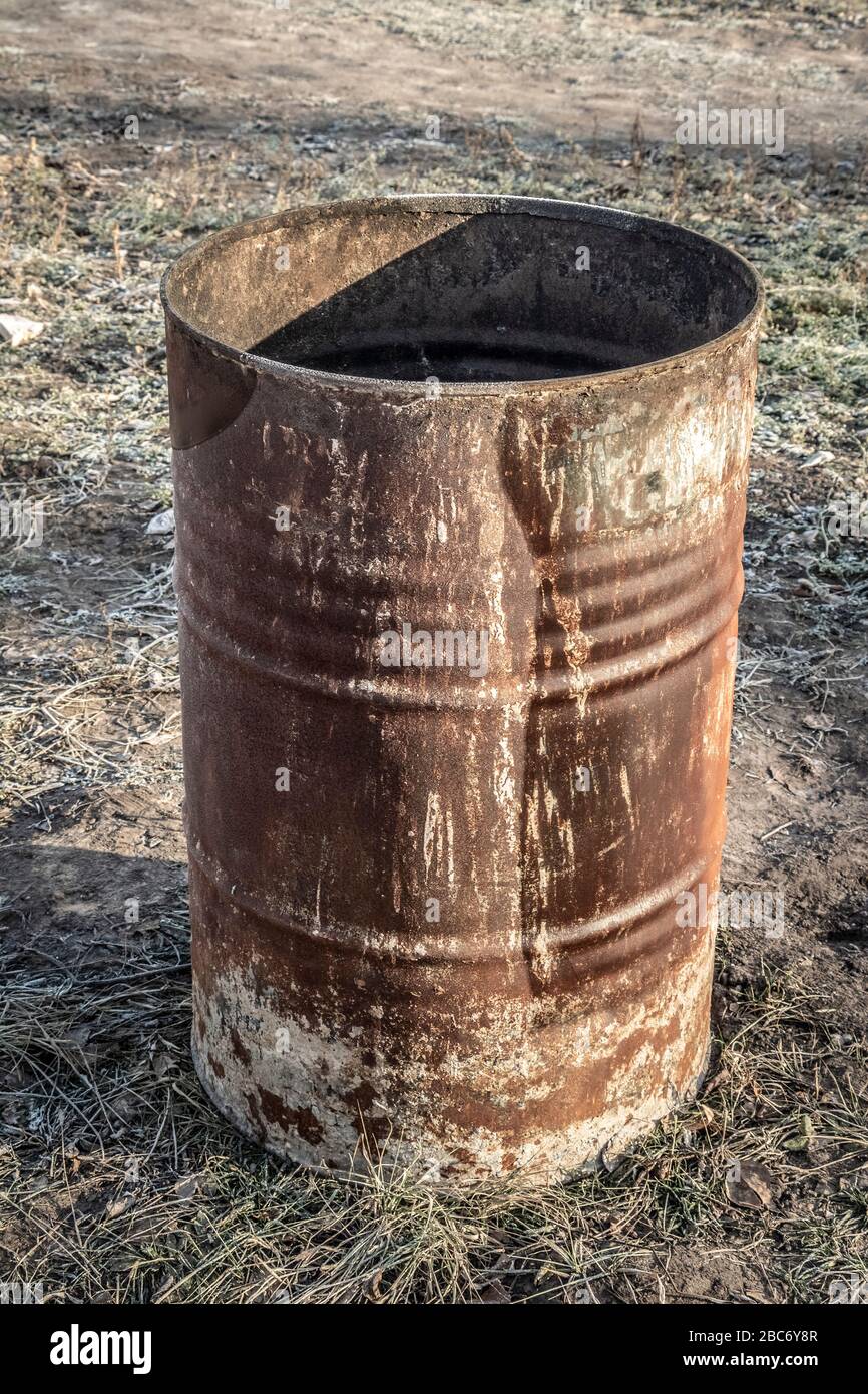 An old rusty barrel stands on a plot Stock Photo - Alamy