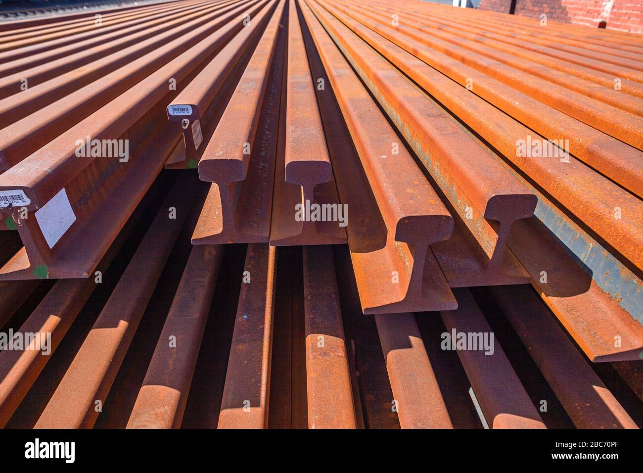 Rail road steel lines sections stacked outdoors closeup abstract photo ...