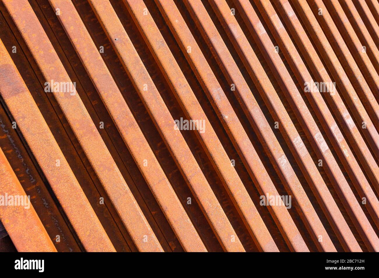 Rail road steel lines sections stacked outdoors closeup abstract photo ...