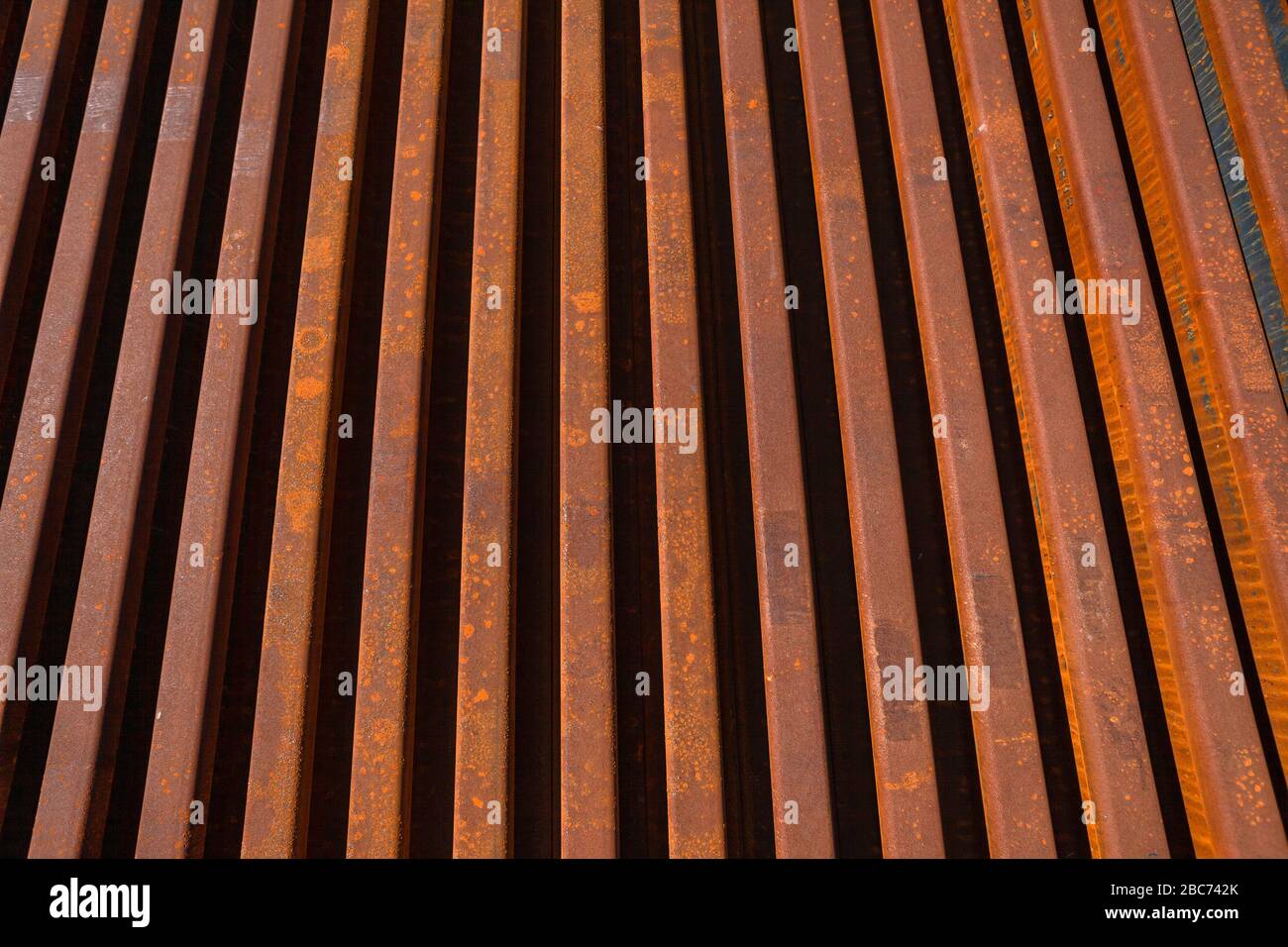 Railway steel lines sections stacked outdoors closeup abstract photo of ...