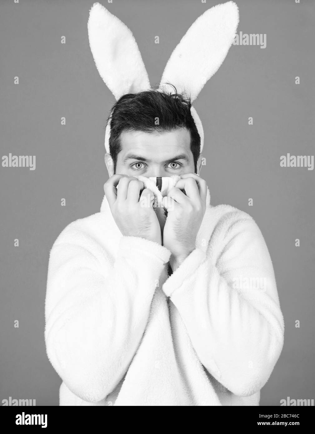 Easter is here. Happy man wearing rabbit ears. Man in easter rabbit ...