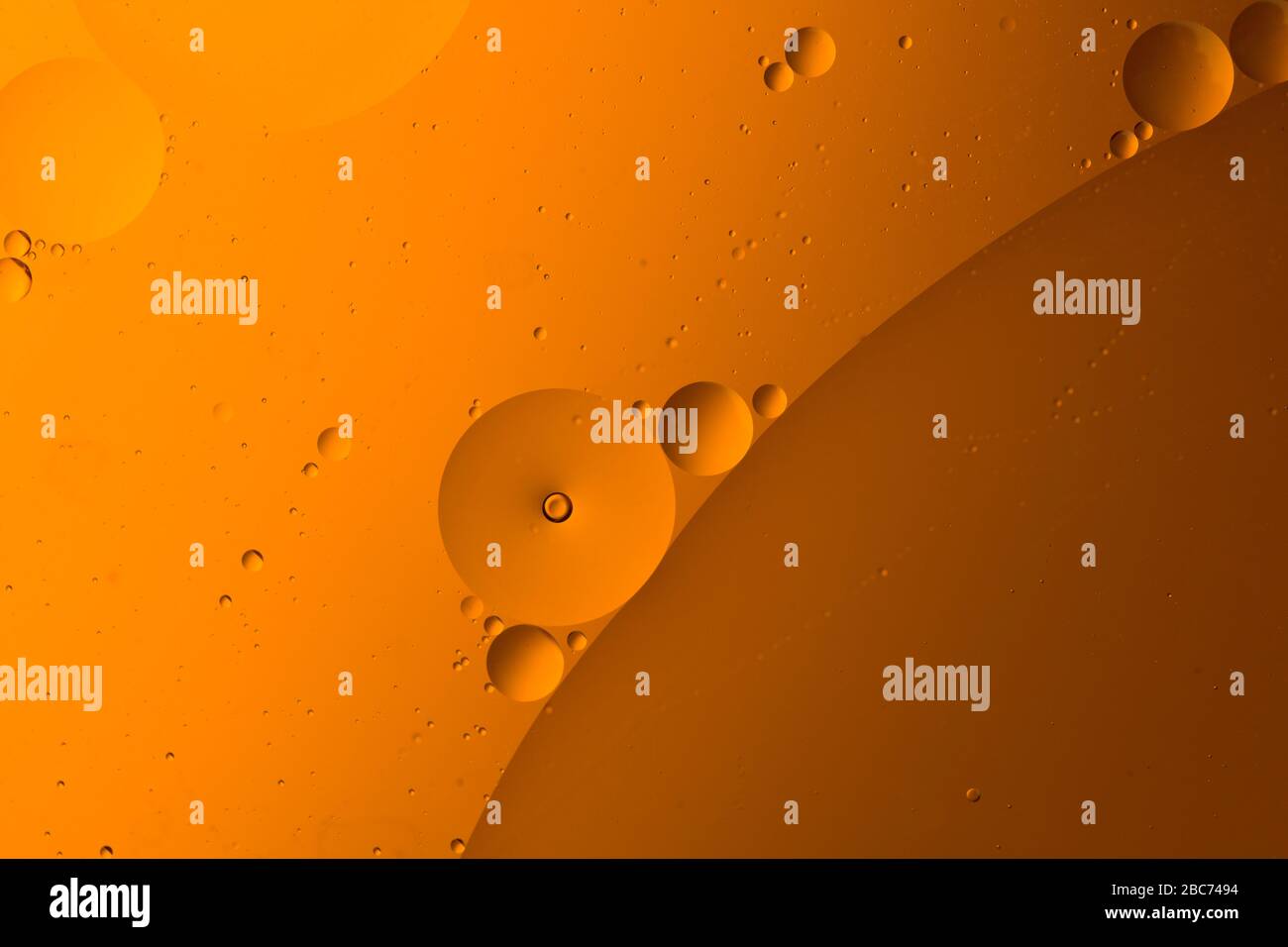 Beautiful abstract background from mixed water and oil. Yellow color ...