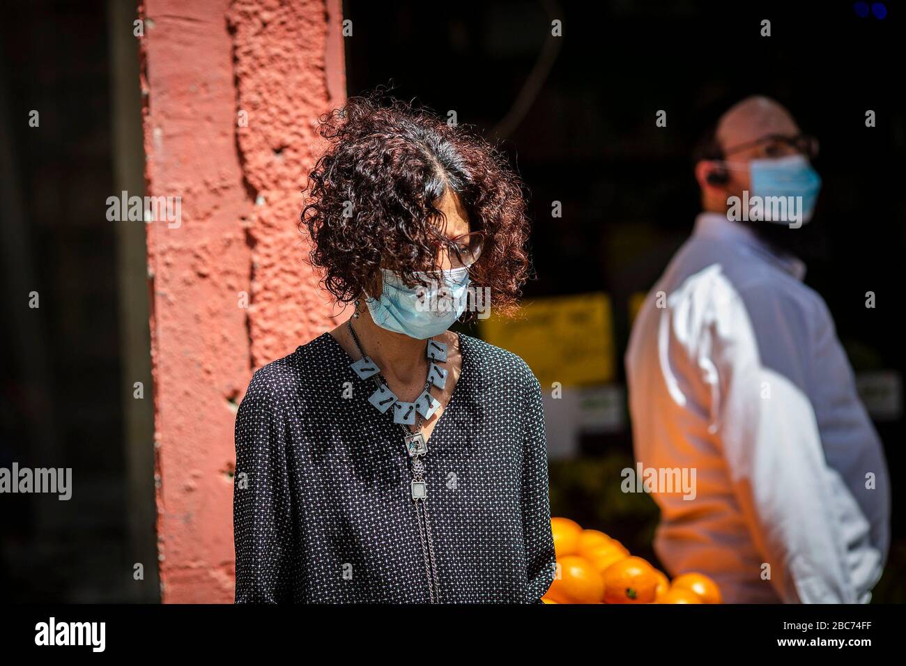 Bnei Brak, Israel. 03rd Apr, 2020. People wearing surgical masks go ...