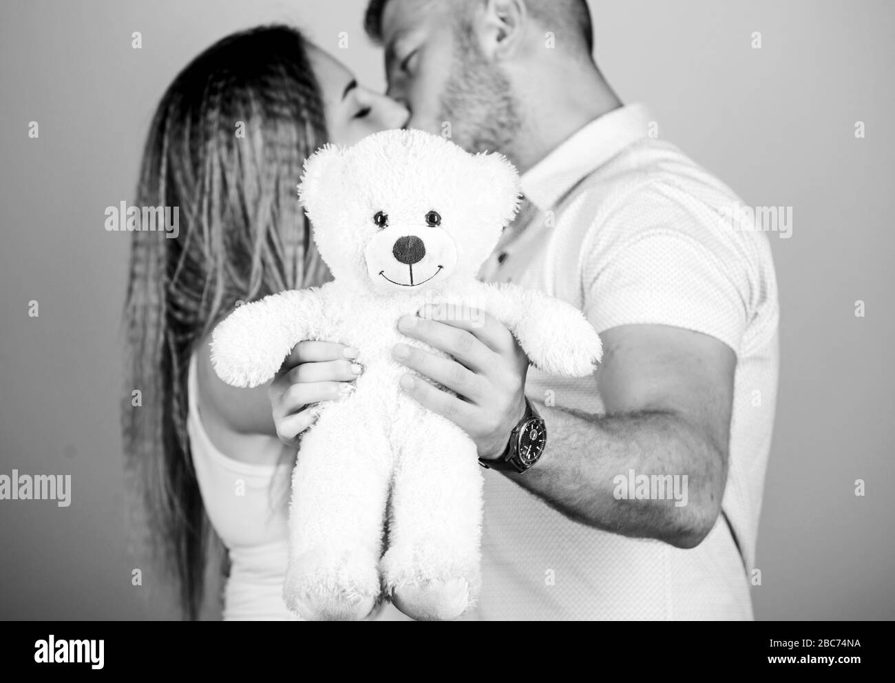 Soft toy teddy bear gift. Guy and girl cuddling. Happy family ...