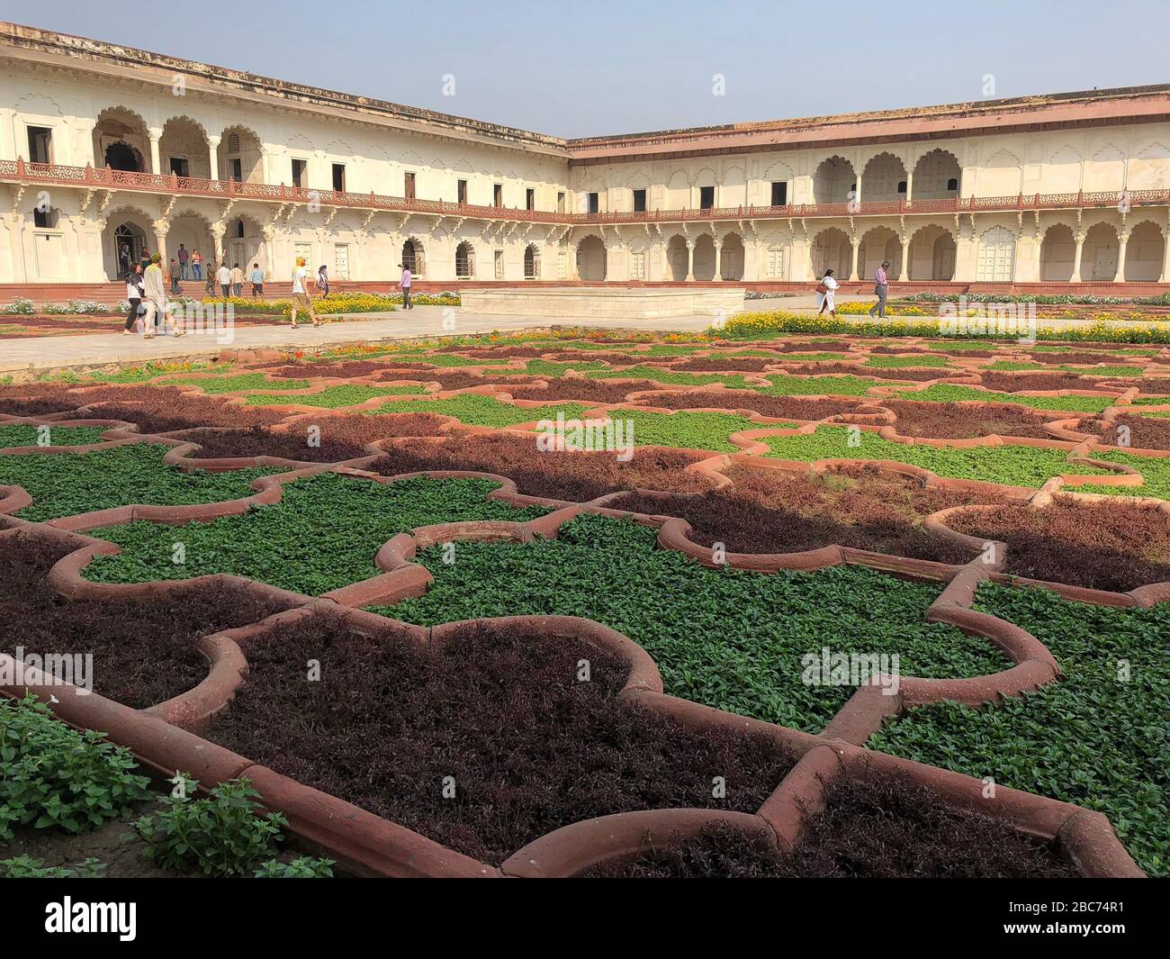 Agra, Uttar Pradesh, India- March 2018: People walk along the beautiful ...