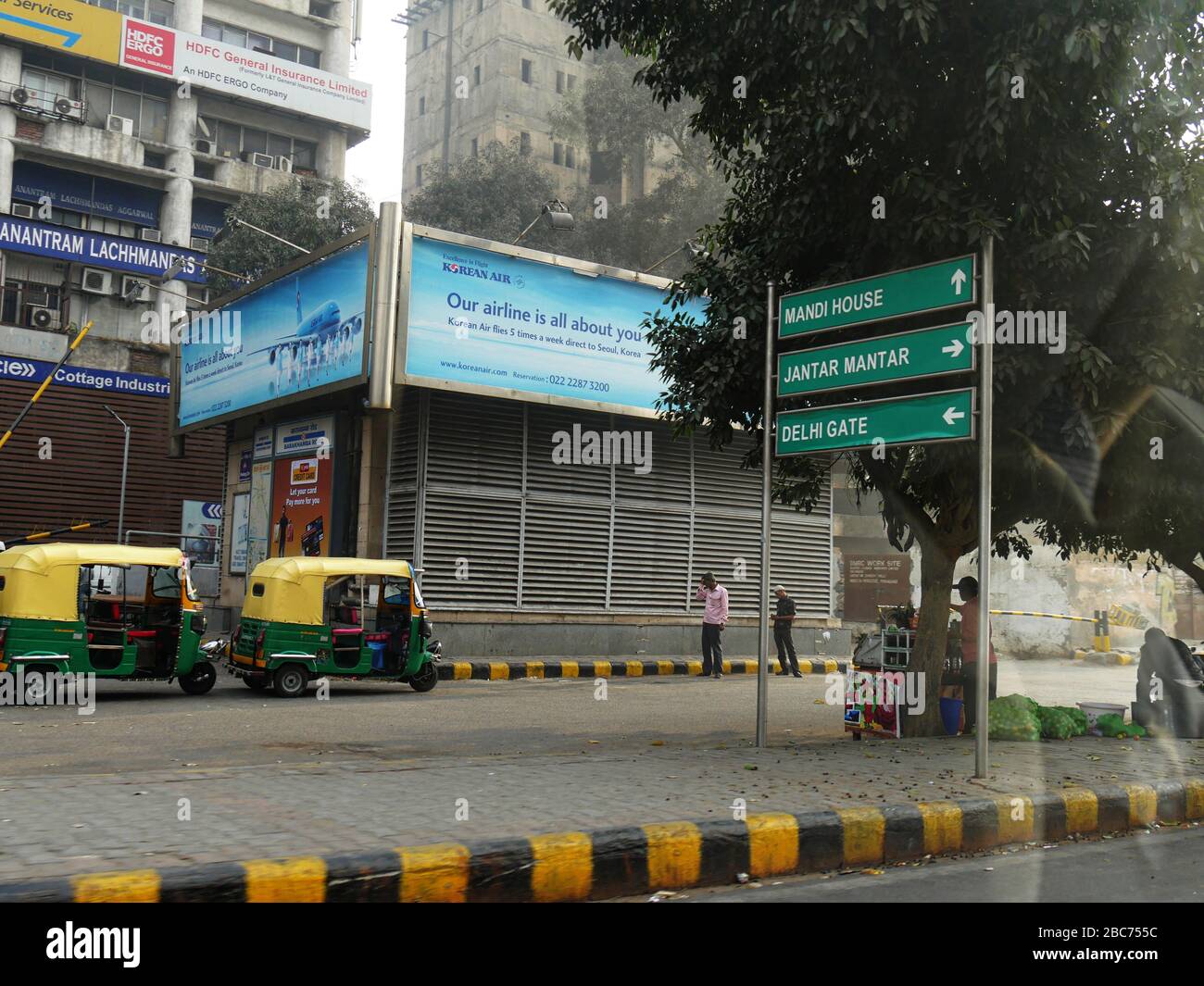 New Delhi, India- March 2018: Directional signs on the road with arrows ...