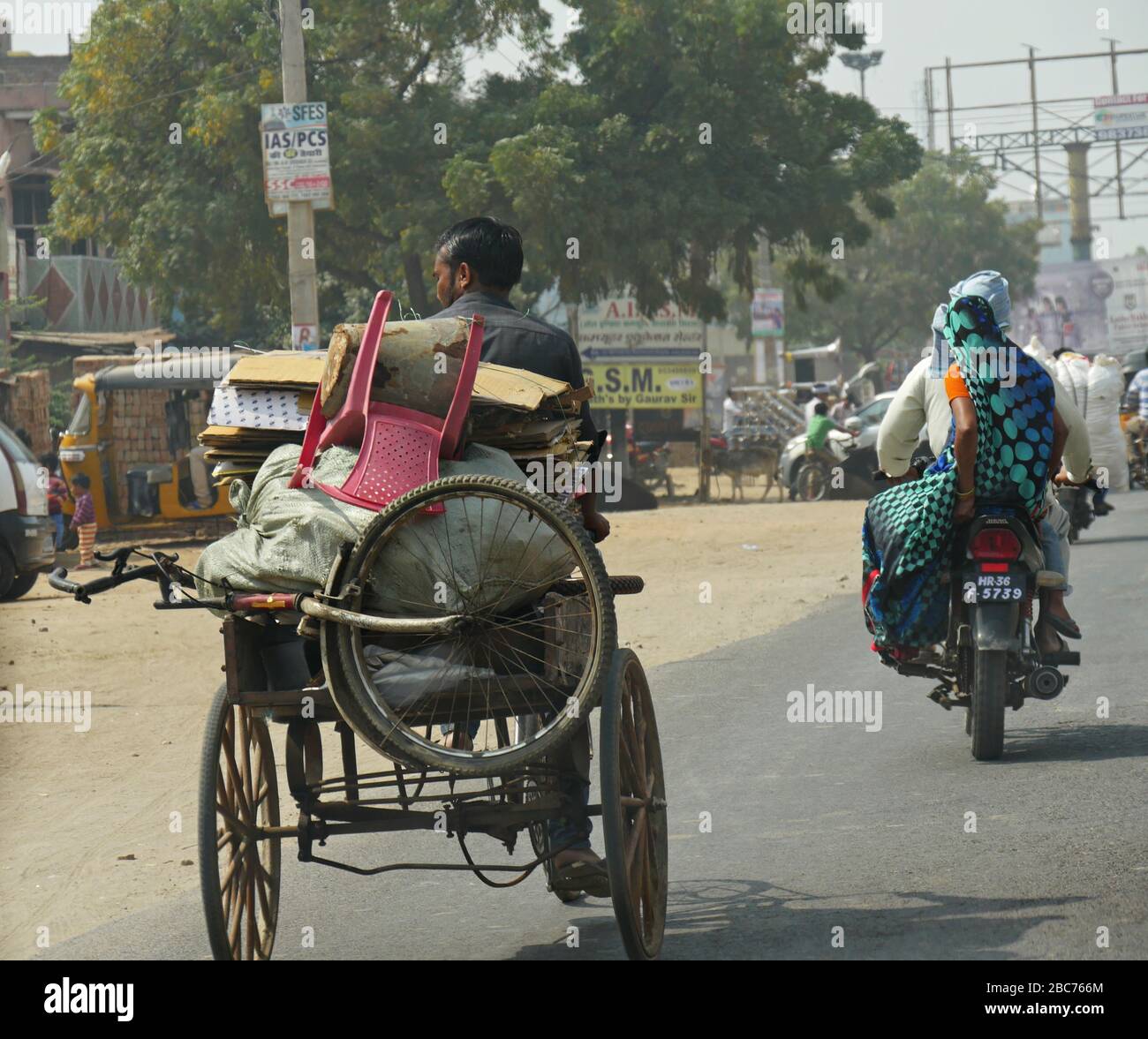 Man and his overloaded bicycle hi-res stock photography and images - Alamy