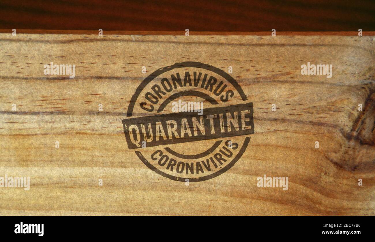 Quarantine stamp printed on wooden box. Covid-19 virus protection ...