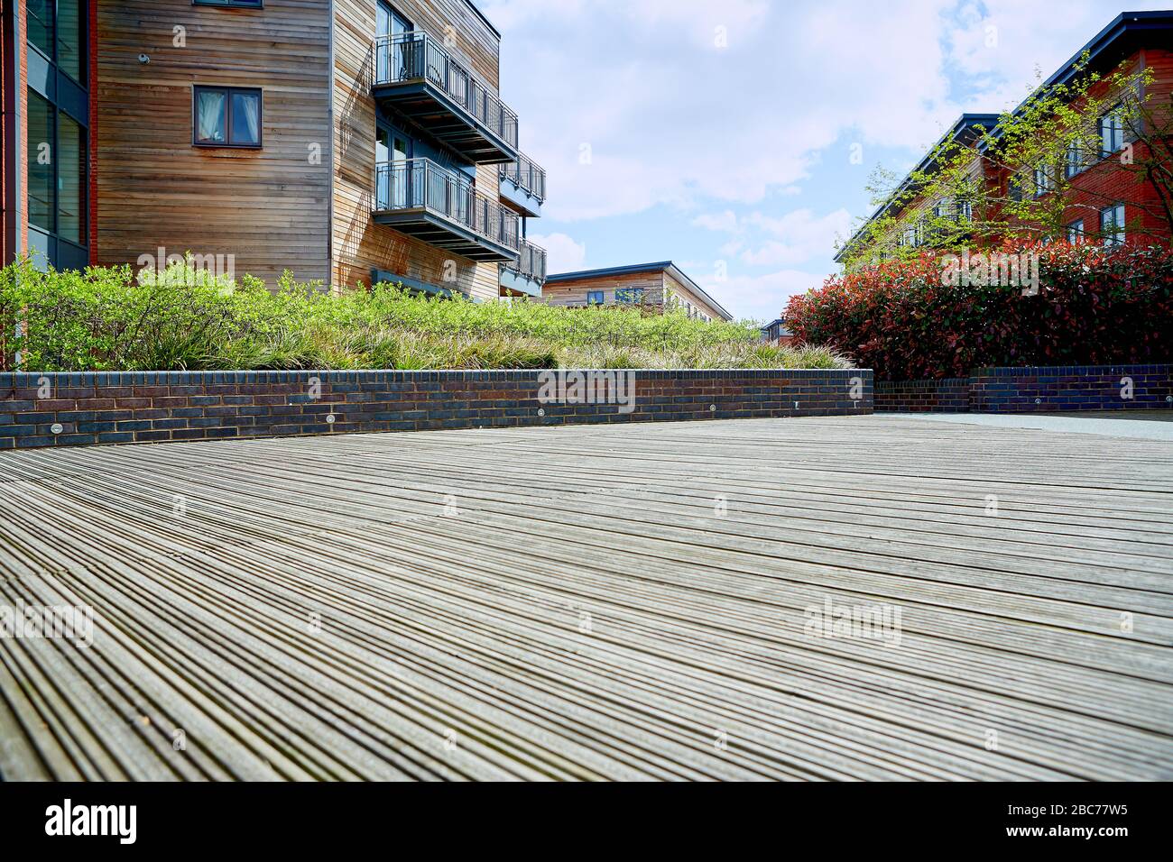 Parking lot in a residential area with houses and apartment buildings ...