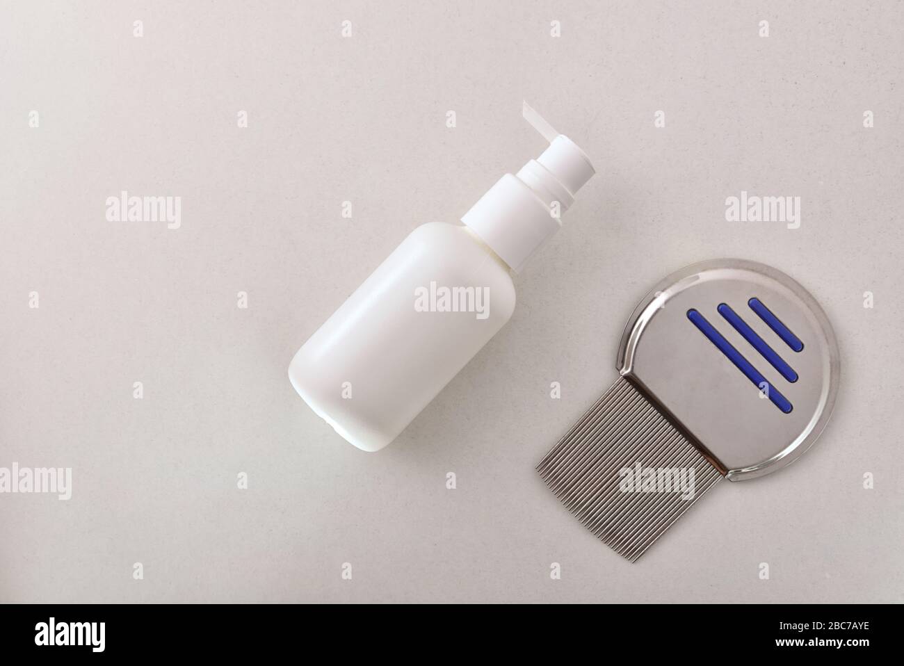 Lice treatment concept with special comb to remove lice from hair and ...