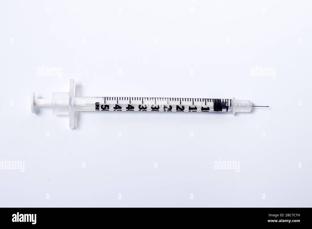syringe over white background Stock Photo - Alamy
