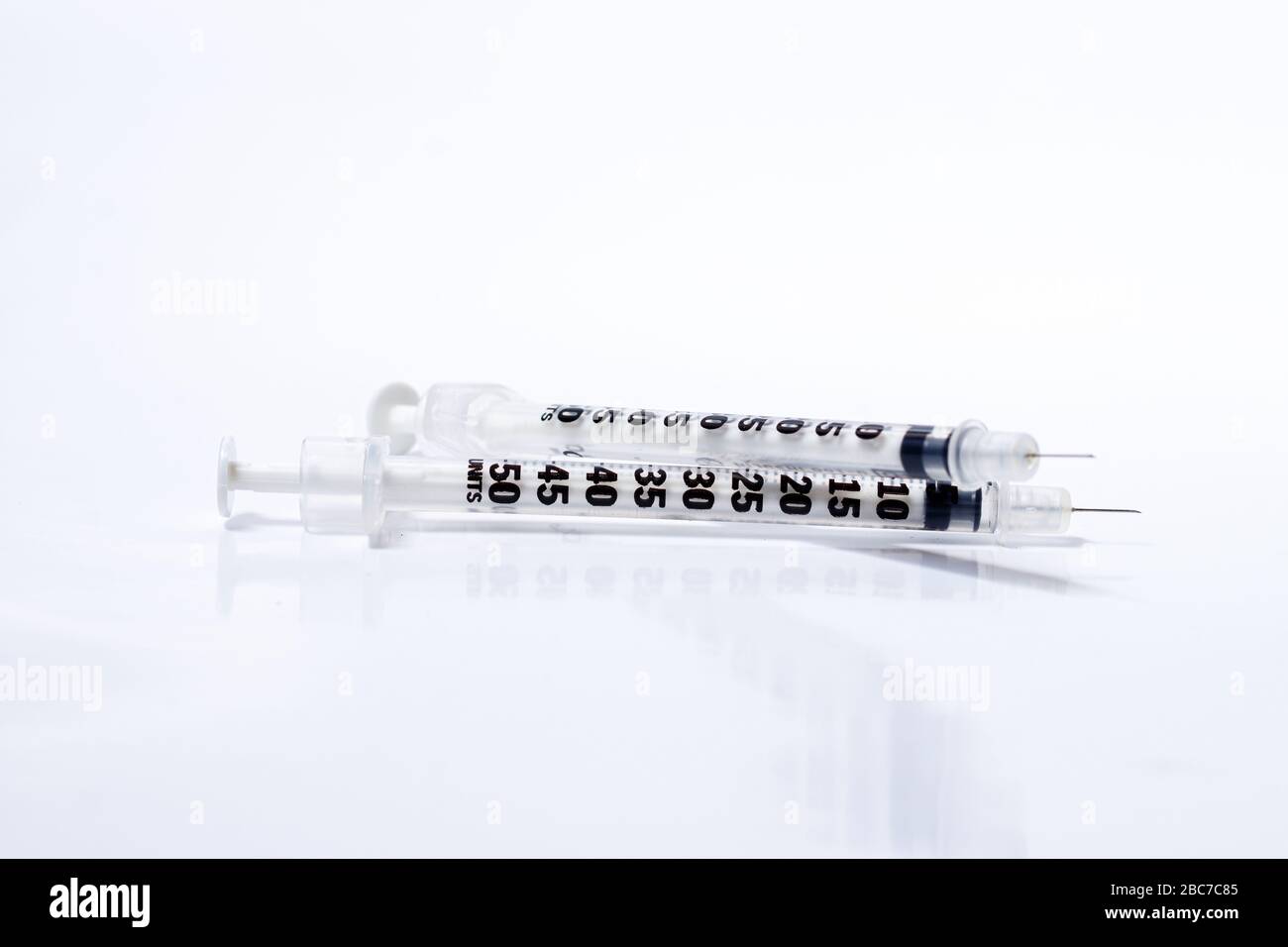 syringe over white background Stock Photo - Alamy