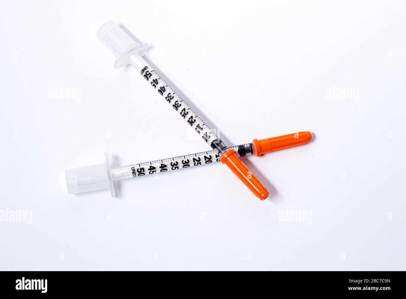 syringe over white background Stock Photo - Alamy