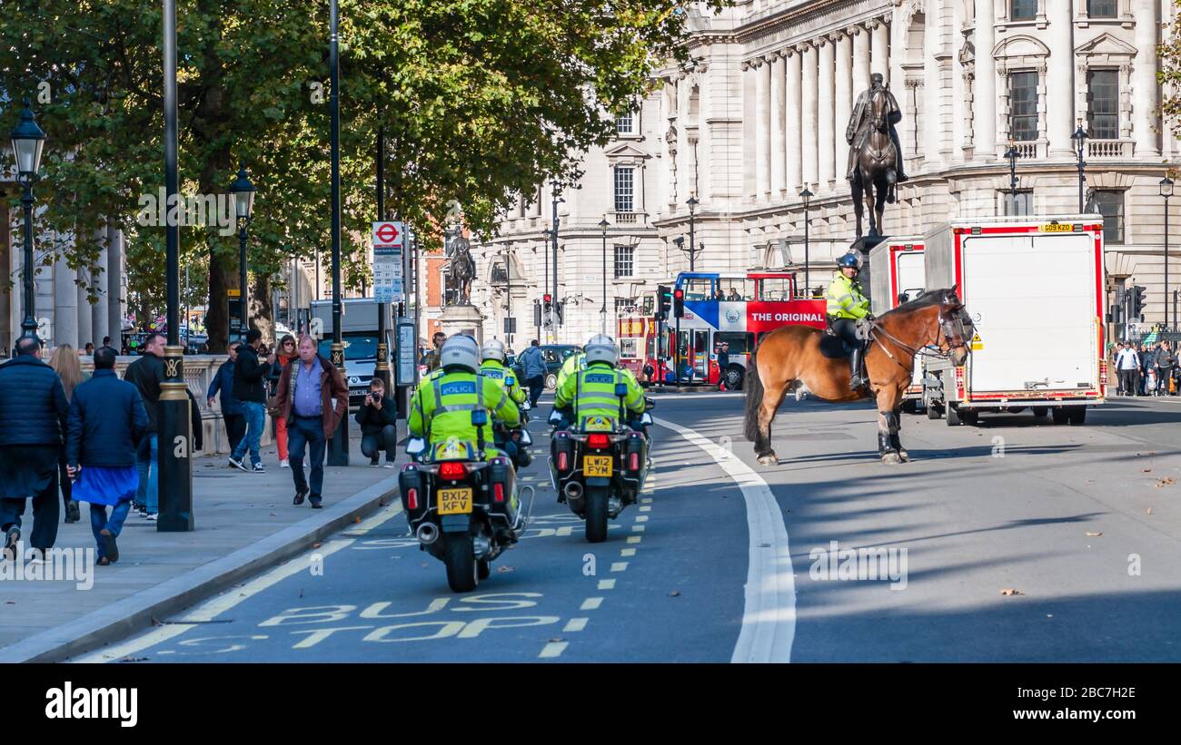 London Police officers on motorcyclists and horses. The height of the ...