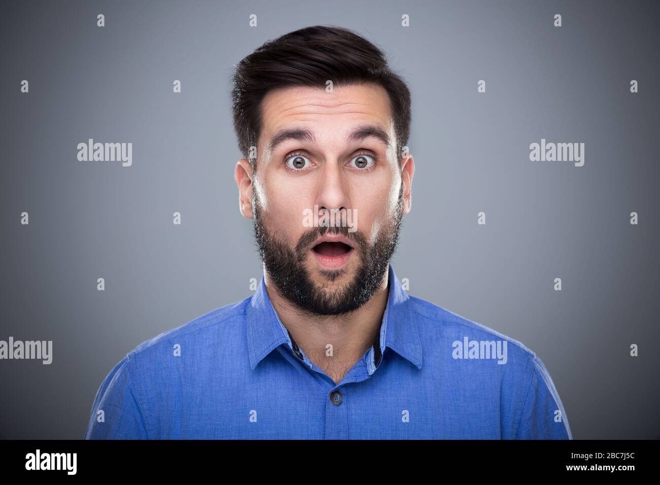 Shocked young man Stock Photo - Alamy
