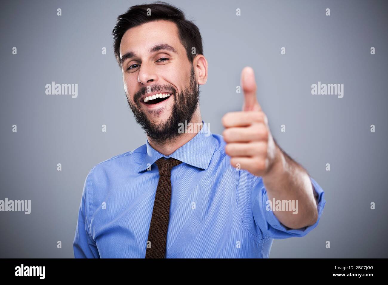 Man showing thumbs up Stock Photo - Alamy