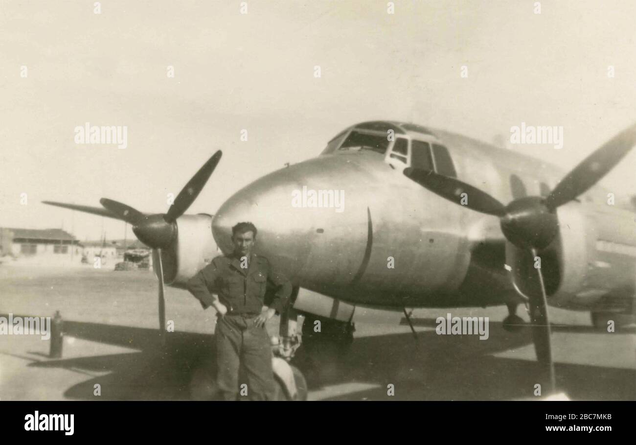 A military closed to a two-engine propeller airxcraft, Italy 1950s ...