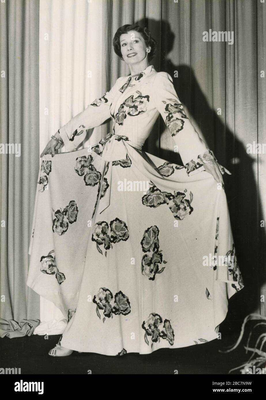 A model wearing a charming Cresta house-coat in spun rayon by Moygashel ...