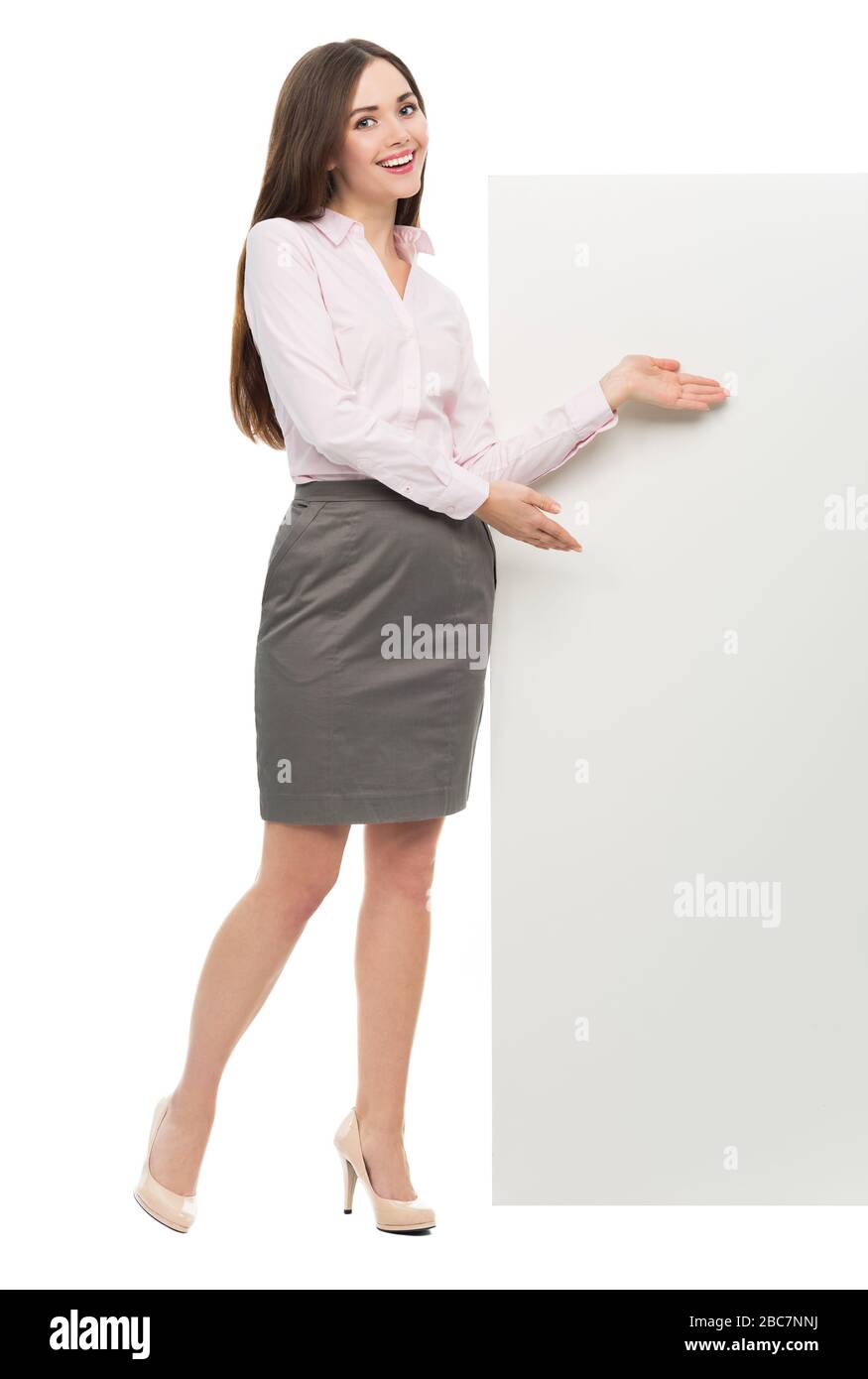 Woman standing next to big white poster Stock Photo - Alamy