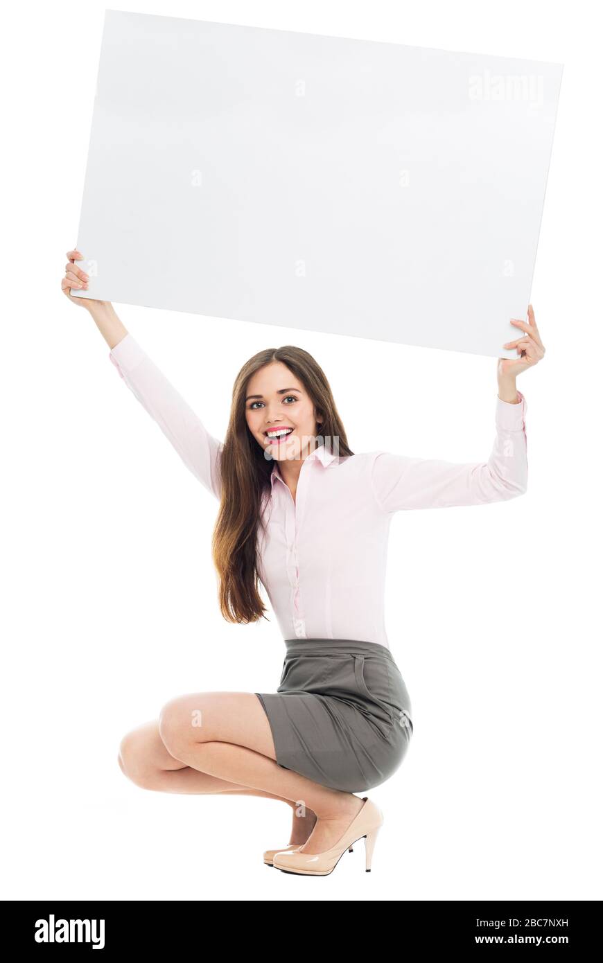 Woman crouching with blank sign Stock Photo - Alamy
