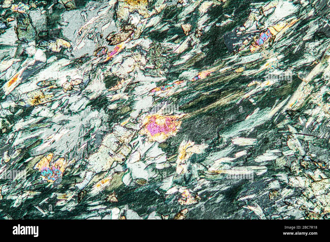 Feldspar rock under the microscope 100x Stock Photo - Alamy