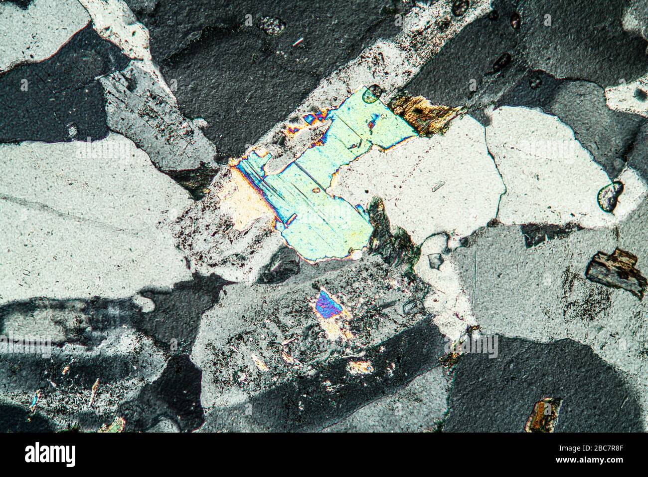 Granite rock under the microscope 100x Stock Photo - Alamy