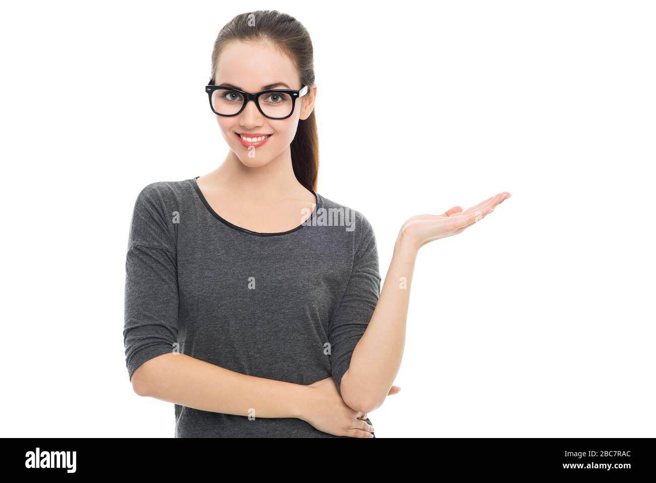 Beautiful woman pointing finger Stock Photo - Alamy