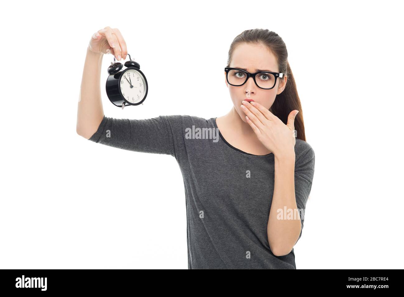 Young woman clock hi-res stock photography and images - Alamy