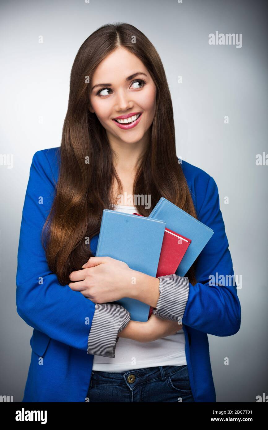 Female student holding books Stock Photo - Alamy