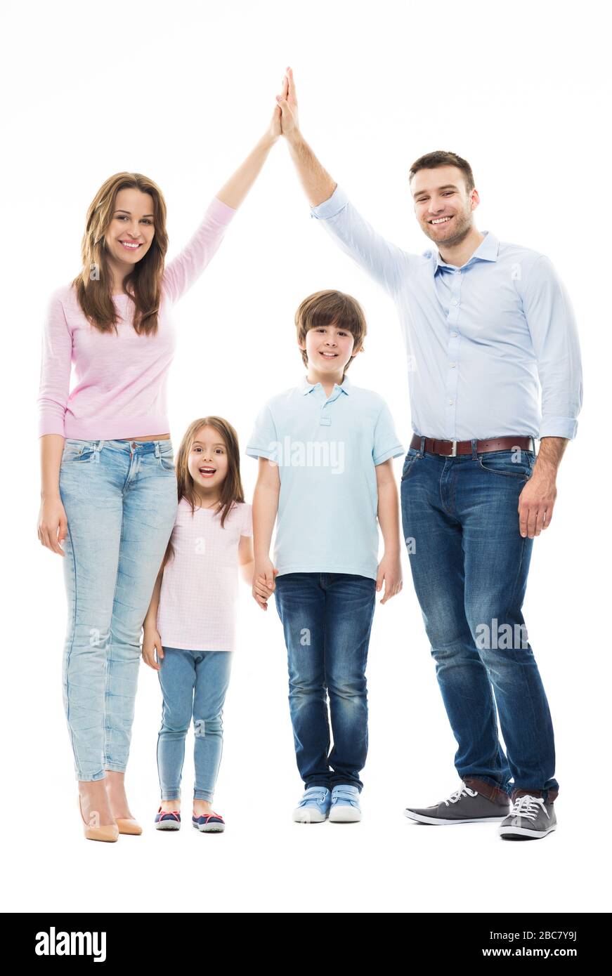 Family forming shape of home Stock Photo - Alamy