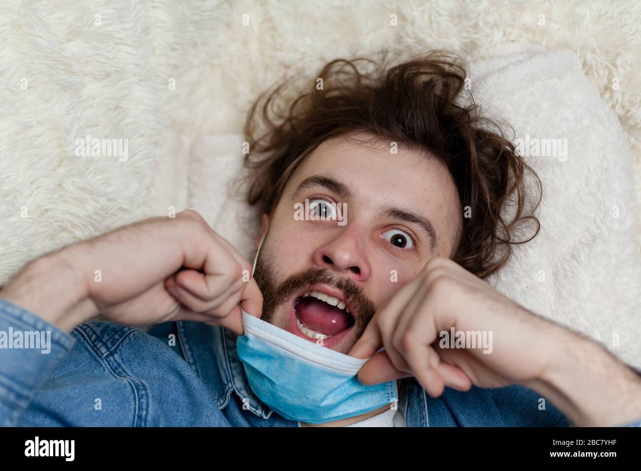 Lone guy at home in quarantine. Staying at home makes you sad and crazy ...