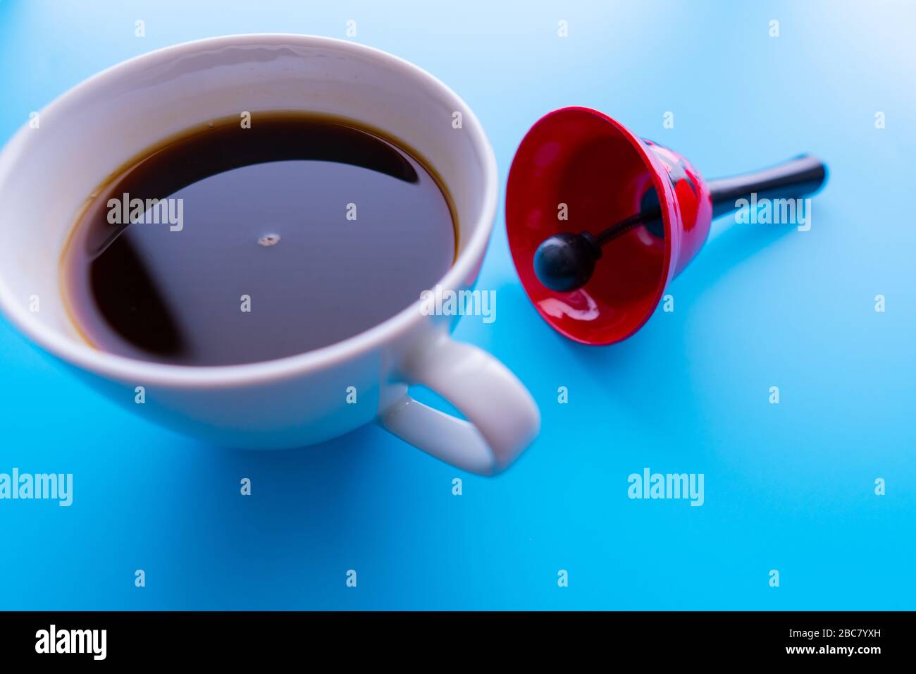 Blue background and bell. In another corner of the picture is a white ...