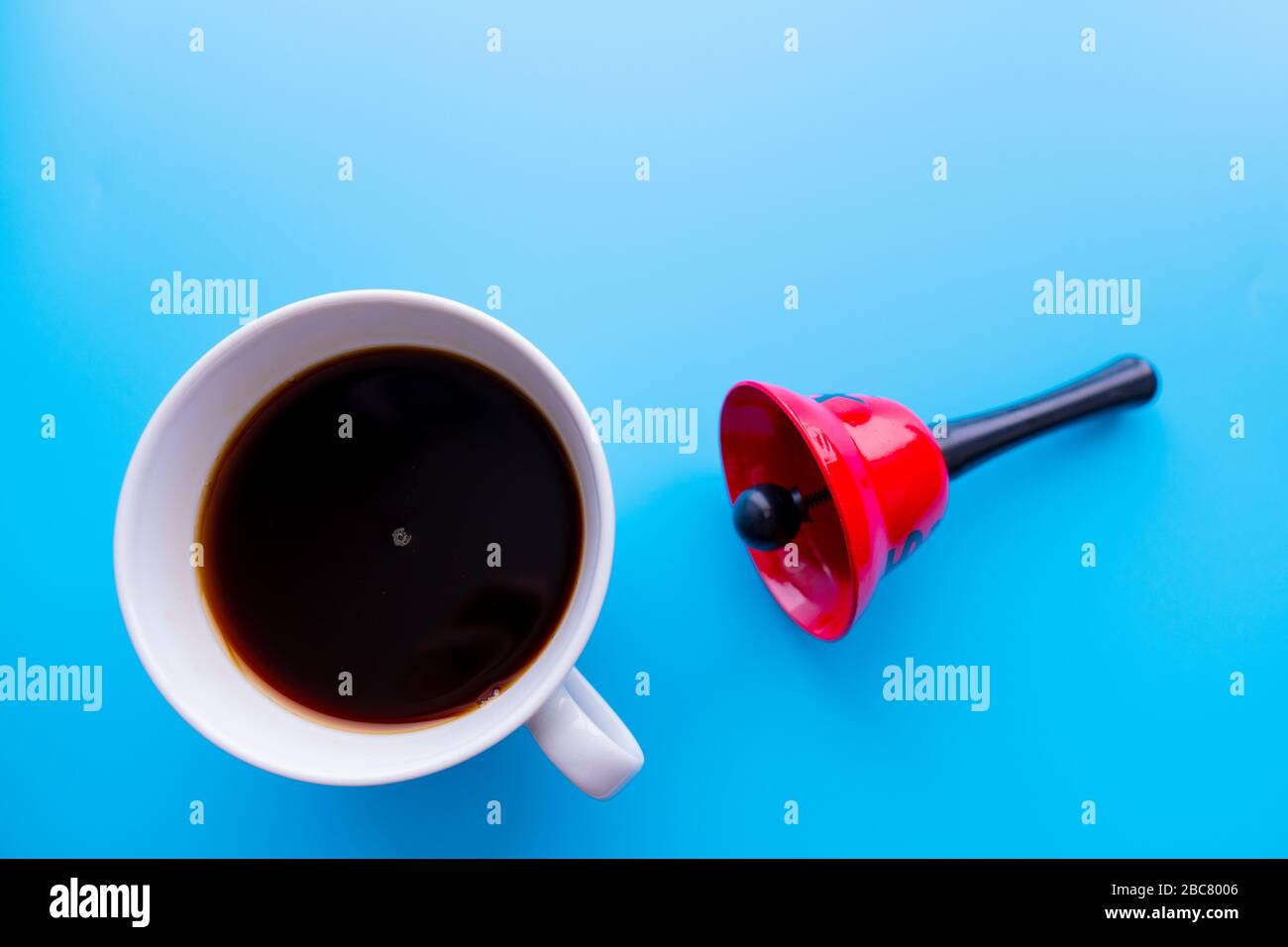 Blue background and bell. In another corner of the picture is a white ...