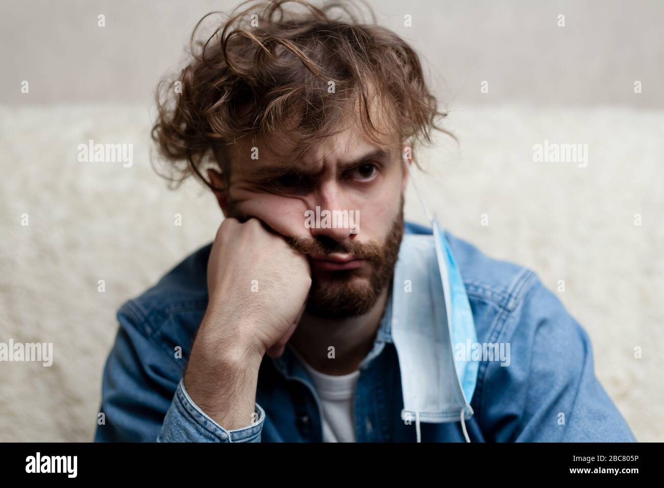 Lone guy at home in quarantine. Staying at home makes you sad and crazy ...