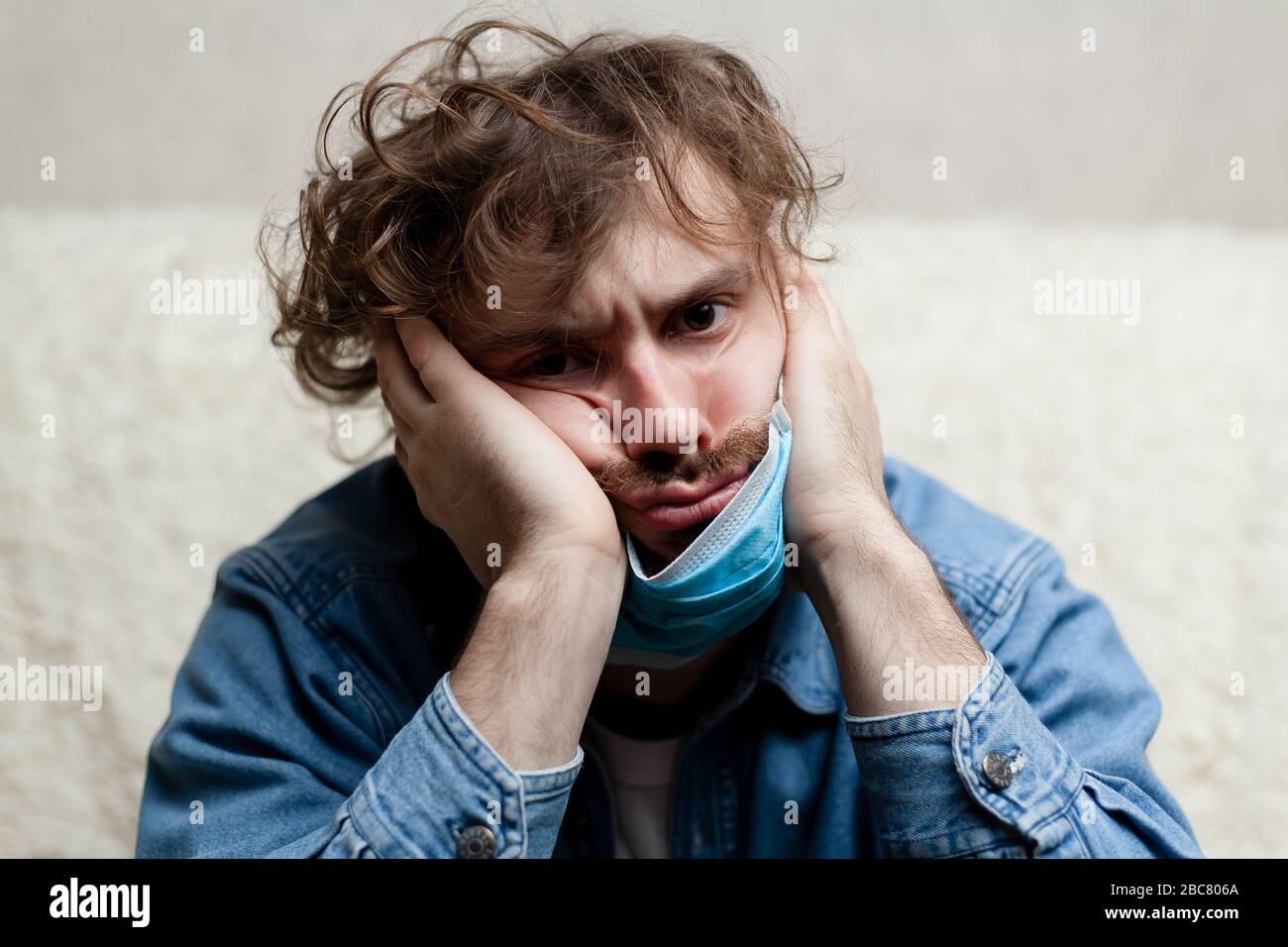 Lone guy at home in quarantine. Staying at home makes you sad and crazy ...