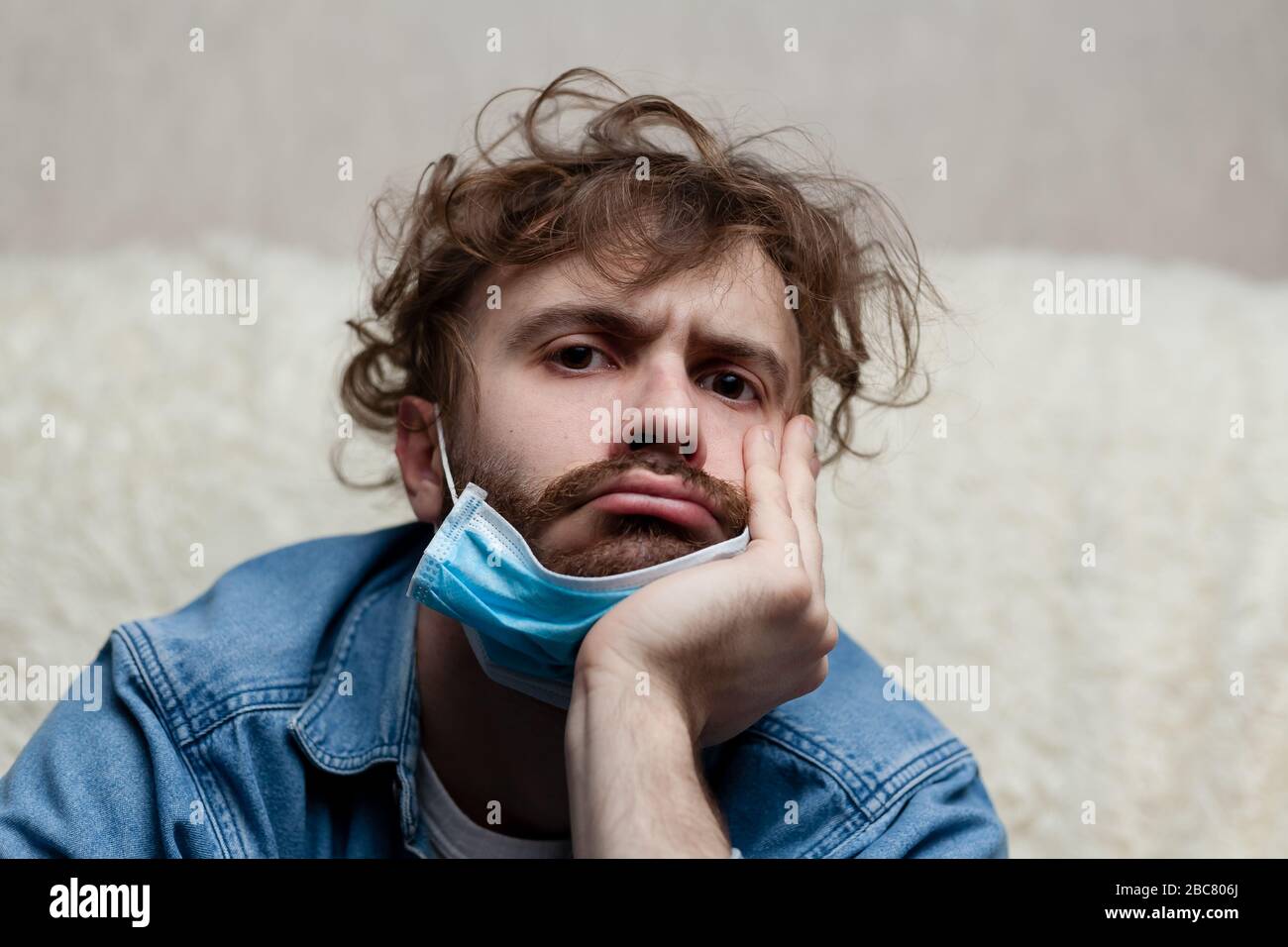 Lone guy at home in quarantine. Staying at home makes you sad and crazy ...