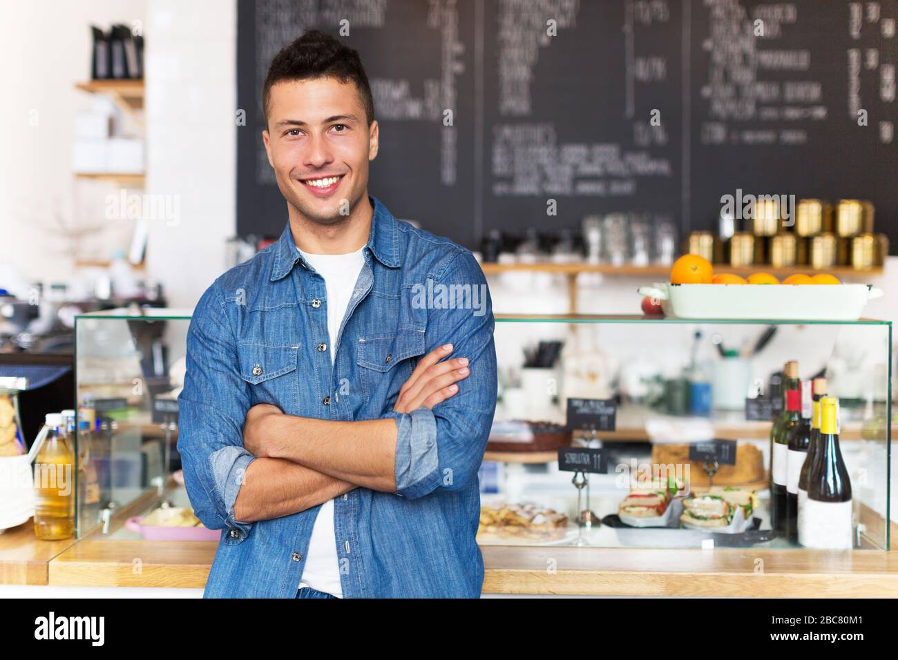 Man working in coffee shop Stock Photo - Alamy